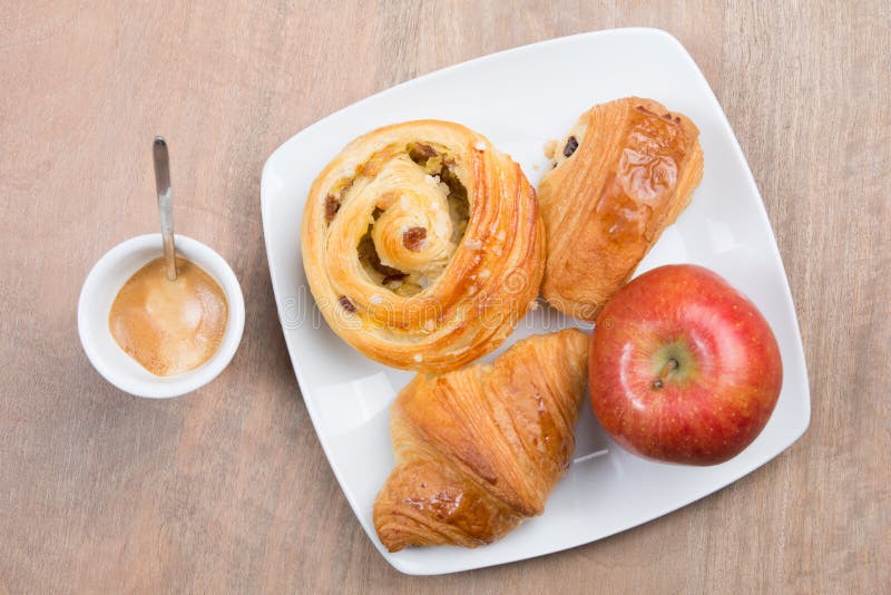 Coffee, Croissants and Apple Under Wooden Table Stock Photo - Image of ...