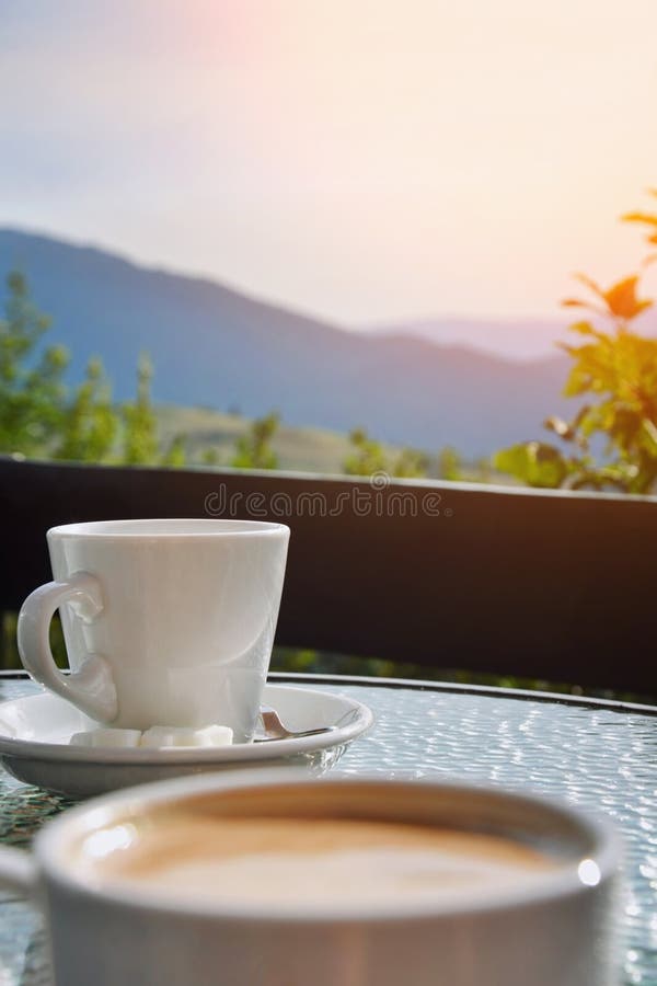 Coffee Cup on a Background of Mountains. Breakfast in Nature. Stock ...