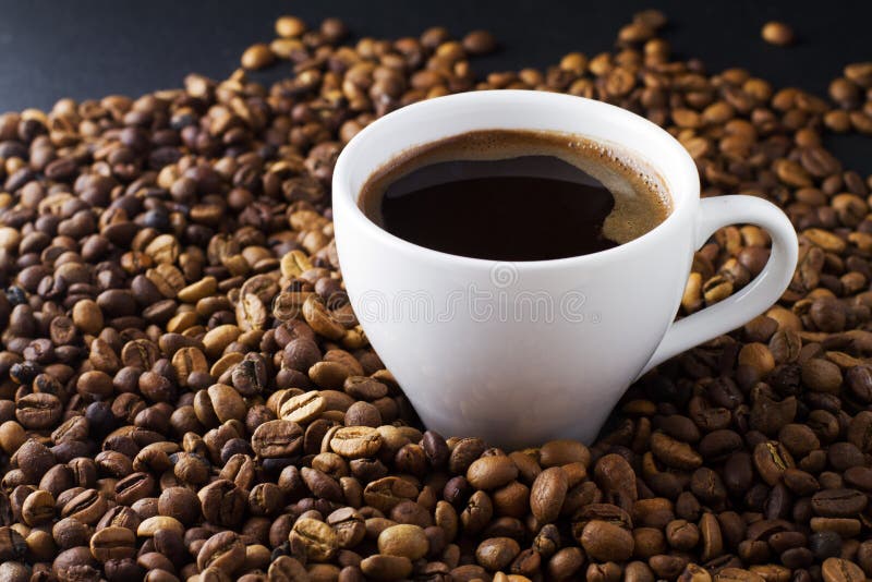 Coffee cup and beans stock photo. Image of background - 26047142