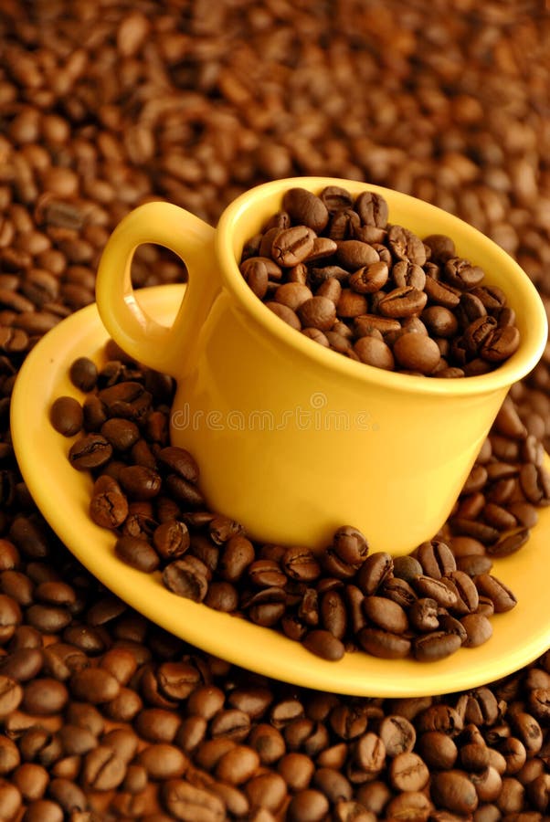 Yellow Coffee Cup with Beans in Brwon and Yellow Colors Stock Photo ...