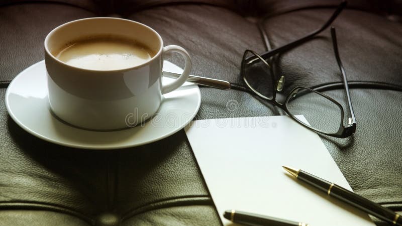 Coffee Cup on Black Leather with Pen and Paper Stock Image - Image of ...