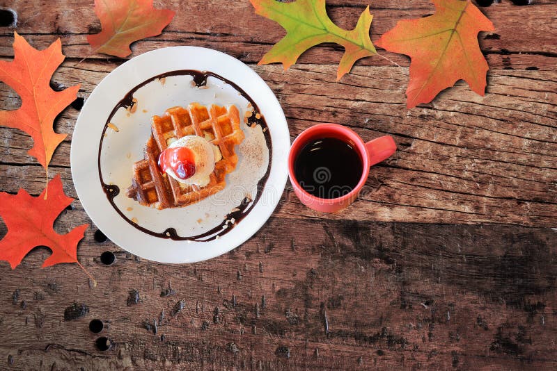 Coffee Cup and Breakfast and Autumn Maple Leaves are on the Old Kitchen ...