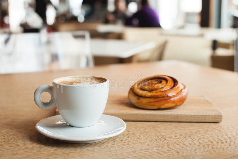 Coffee Cup and Bun with Cinnamon in Cafe Stock Photo - Image of cooking ...