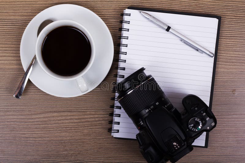Coffee Cup and Camera on a Wooden Surface Stock Image - Image of table ...