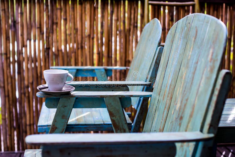 Coffee cup on the chair stock image. Image of comfort - 34483625
