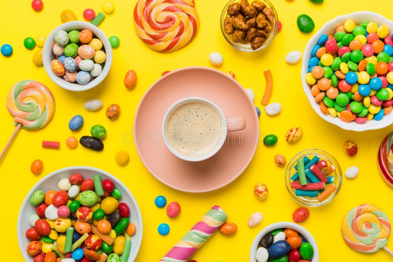 Coffee Cup with Chocolates and Colored Candy. Top View on Table ...