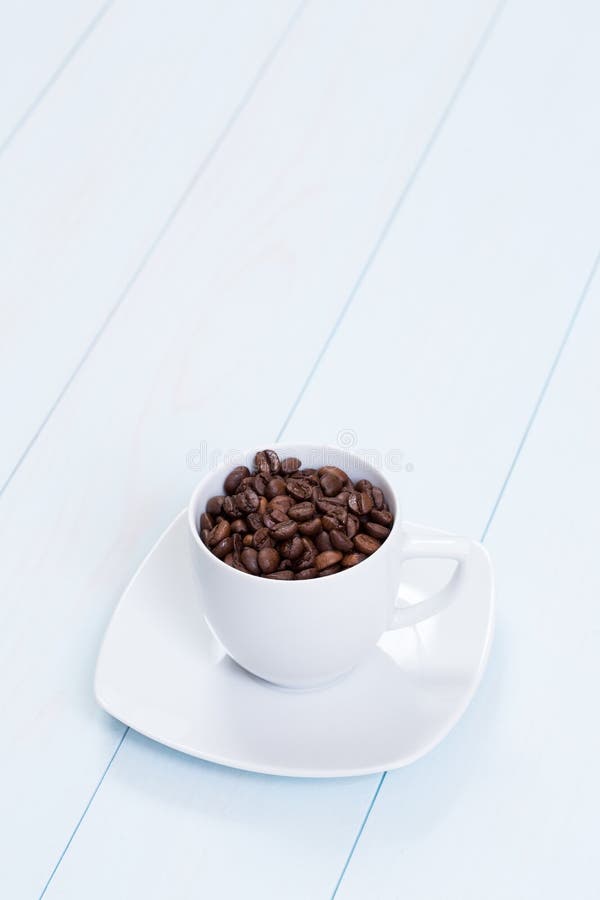 Coffee Cup with Coffee Beans on Table Stock Photo - Image of roasted ...