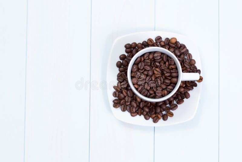 Coffee Cup with Coffee Beans on Table Stock Photo - Image of brewed ...