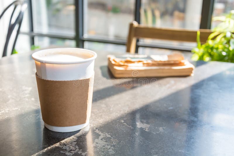 Coffee cup in coffee shop stock photo. Image of style - 81544020