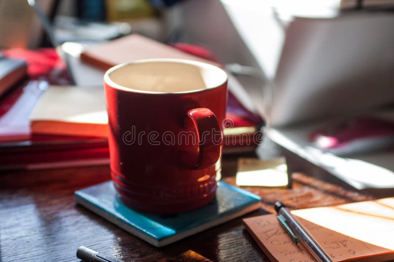 Coffee cup on a desk stock photo. Image of desk, cluttered - 50933606