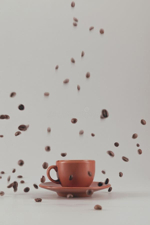 Coffee Cup with Falling Coffee Grains Isolated on Grey Stock Photo ...