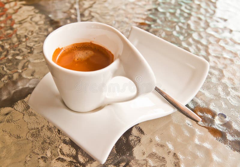 Coffee cup on glass table stock image. Image of gourmet - 23981035