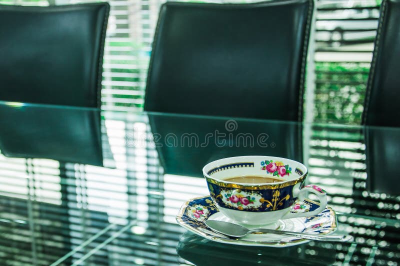 Coffee cup on glass table stock image. Image of reflection - 90916549