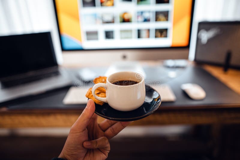 Coffee Cup,hand Holding a Cup of Coffee at the Desk Stock Image - Image ...