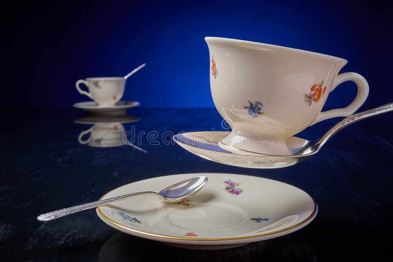 Coffee cup inside of spoon stock image. Image of balance - 379357255