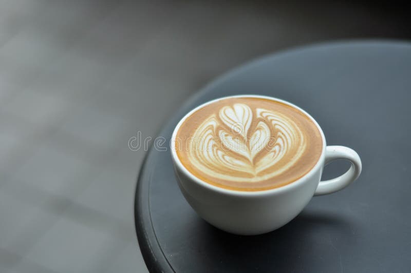 Coffee Cup with Latte Art on the Black Metal Table Stock Image - Image ...