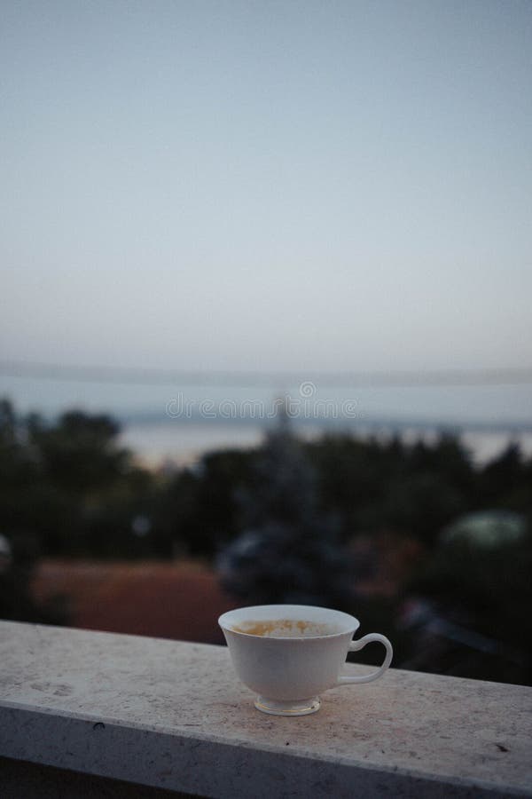 Coffee Cup on Ledge on Blurred Landscape Backdrop Stock Image - Image ...