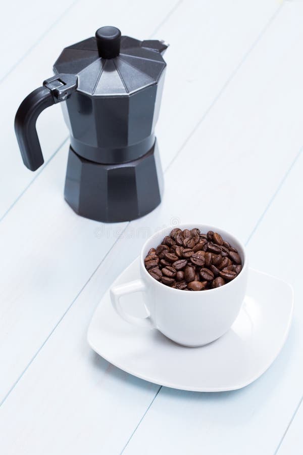 Coffee Cup and Moka Pot with Coffee Beans on Table Stock Photo - Image ...
