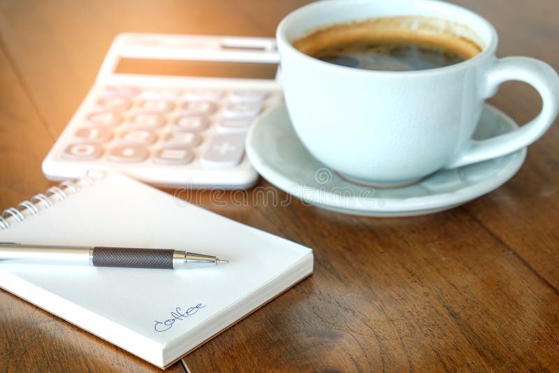Coffee Cup and Notebook with Calculator on Wooden. Stock Photo - Image ...