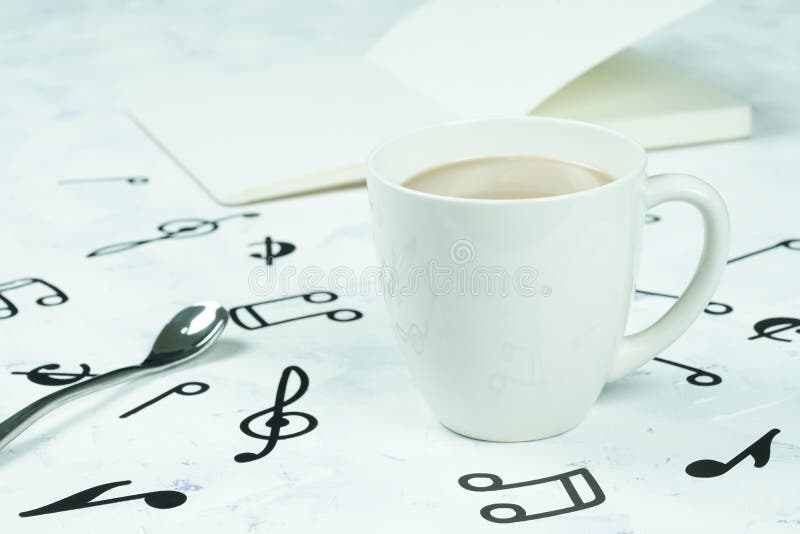 Coffee Cup and Notebook Placed on the Floor, Musical Note Pattern Stock ...