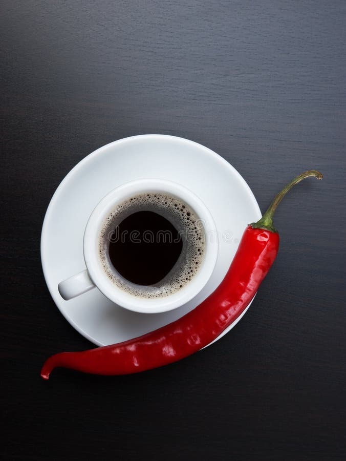Coffee cup and red peppers stock image. Image of heap - 155447285