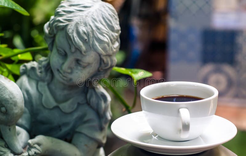 Coffee Cup and Sculpture of Angel Stock Image - Image of collection ...