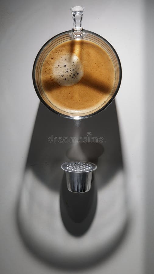 Coffee Cup with Shadow Projected on a White Table Stock Image - Image ...