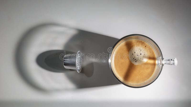Coffee Cup with Shadow Projected on a White Table Stock Photo - Image ...