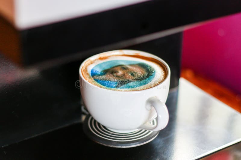 Coffee Cup Standing in the Printer with Printed Face on the Foam. Stock ...