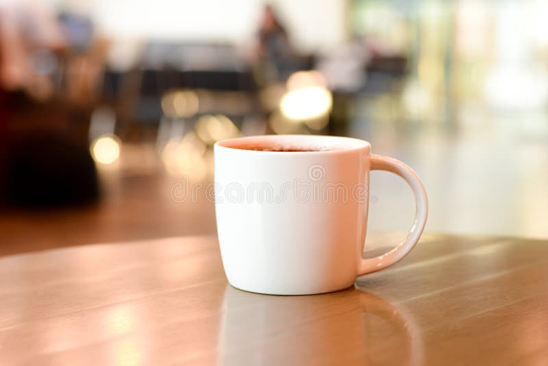 Coffee Cup on the Table in Coffee Shop Stock Photo - Image of ...