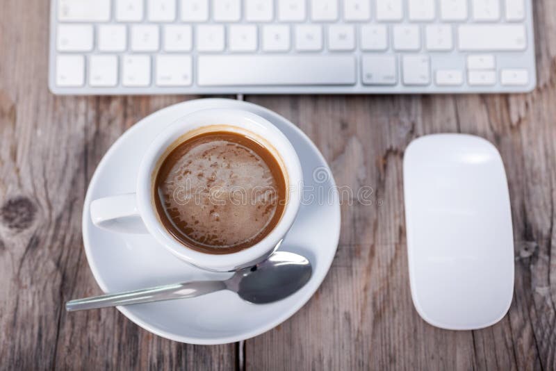 Coffee Cup On The Table With Computer Keyboard For Business Concept