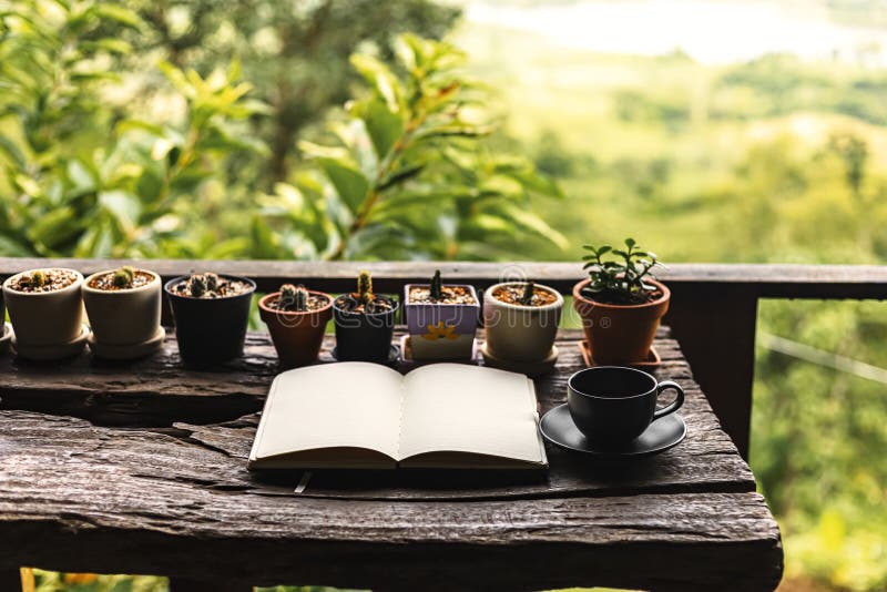 Coffee Cup on the Table Near Book in the Morning Stock Photo - Image of ...
