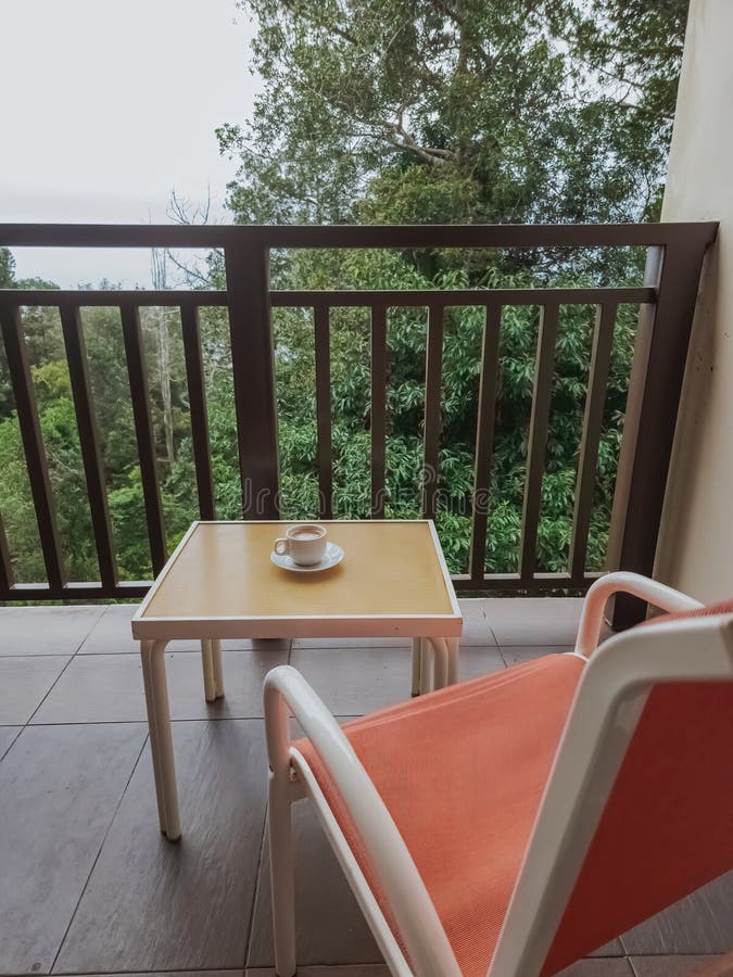 Coffee in Cup on the Table with Seating at the Balcony. Retro Style ...