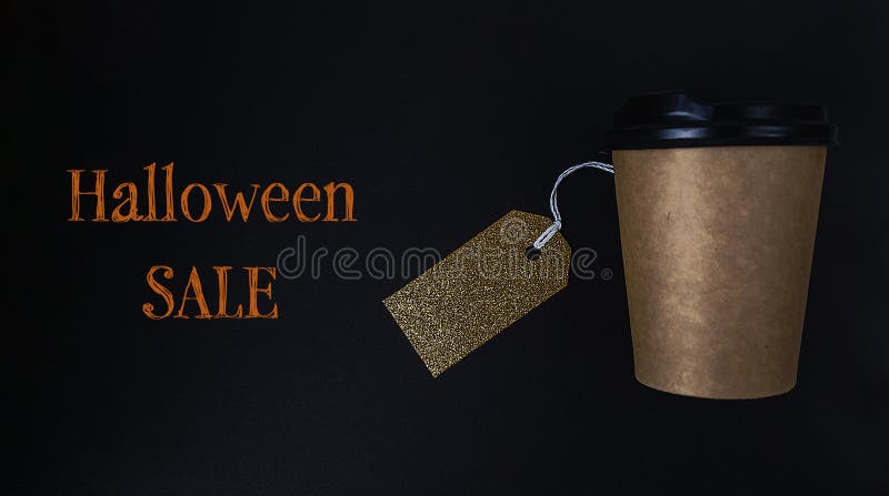 Coffee Cup with a Tag on it that Says Halloween Sale Stock Photo ...