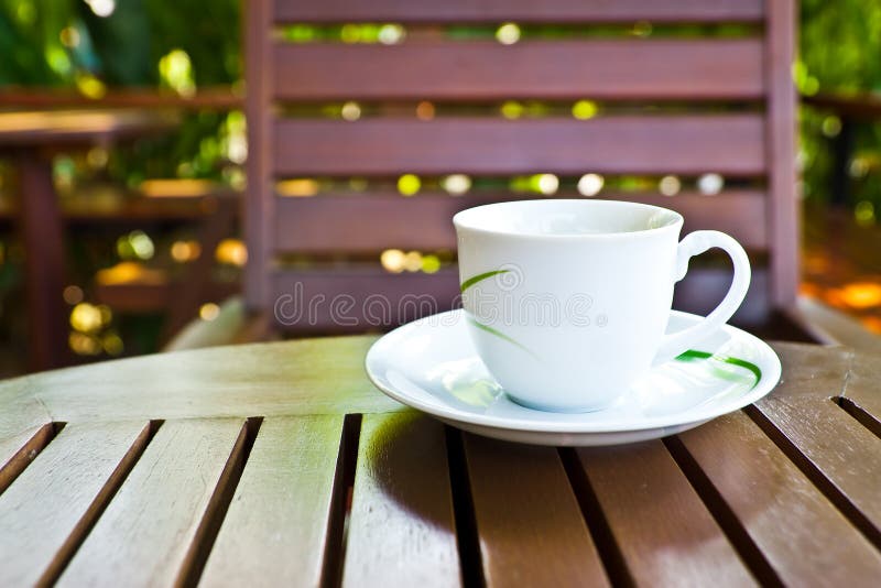 Coffee cup on wood table stock image. Image of relaxation - 12295959