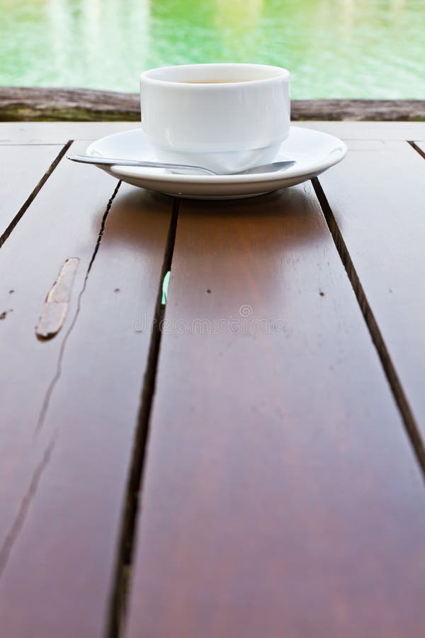 Coffee cup on wood table stock image. Image of milk, brown - 21262395