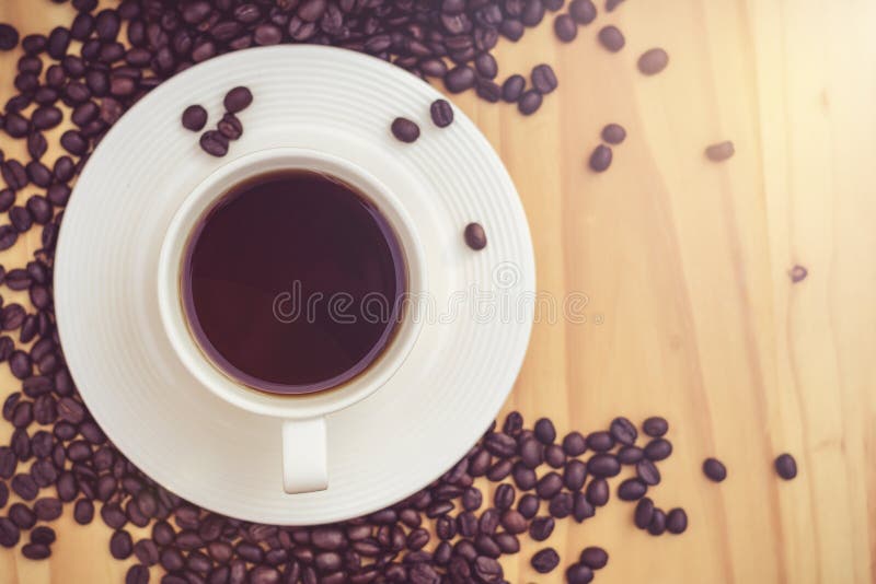 Coffee cup on wood table stock image. Image of closeup - 92571543