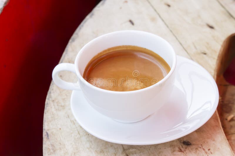 Coffee cup on wood table stock photo. Image of tasty - 139041586