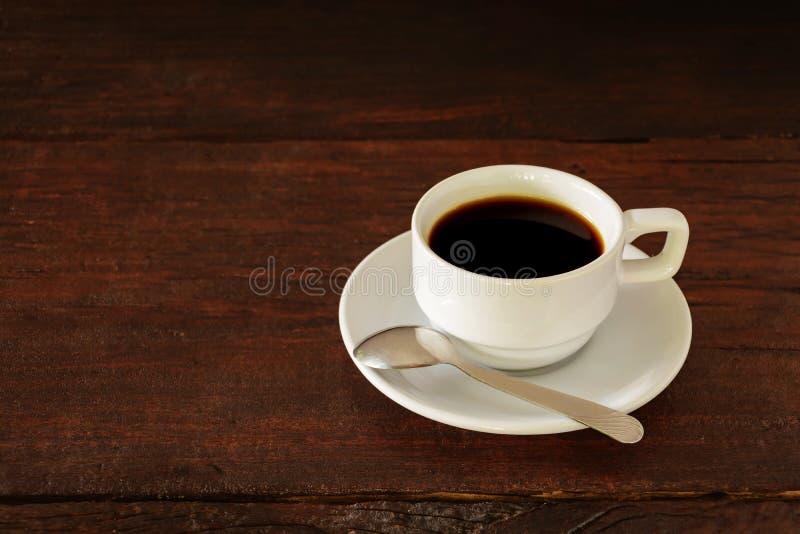 Coffee cup on wood table stock photo. Image of drink - 91390540