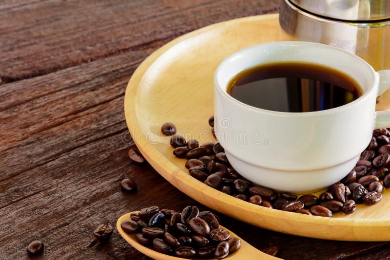 Coffee cup on wood table stock photo. Image of black - 91391074