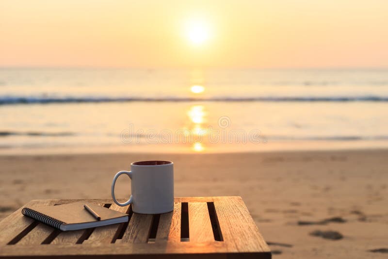 Coffee Cup on Wood Table at Sunset or Sunrise Beach Stock Image - Image ...