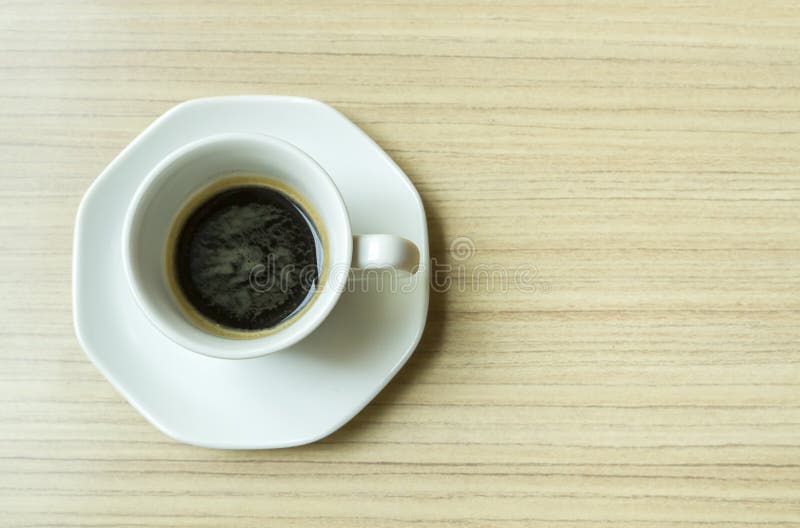 Coffee cup on wood table stock photo. Image of color - 140849966