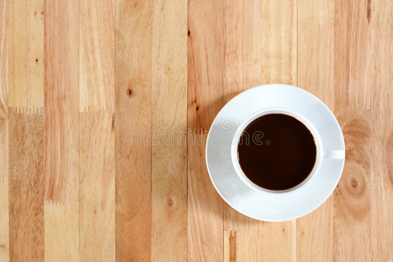 Coffee cup on wood table stock image. Image of table - 49196843