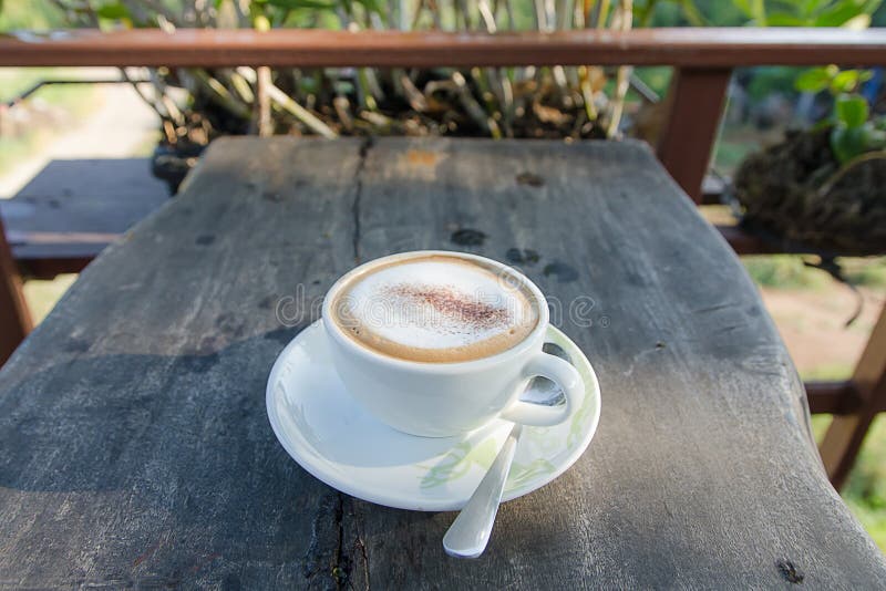 Coffee cup on wooden table stock image. Image of coffee - 45175311
