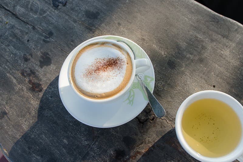 Coffee cup on wooden table stock image. Image of background - 45175429