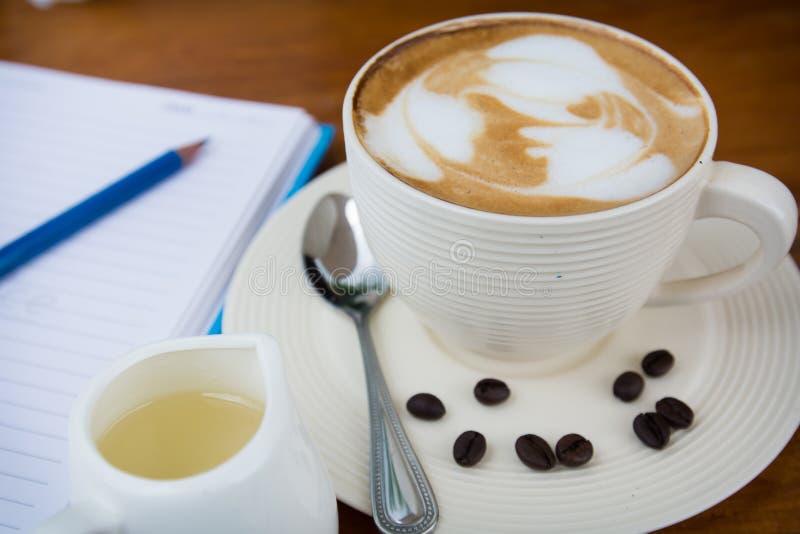 Coffee cup on wooden table stock photo. Image of espresso - 61254754