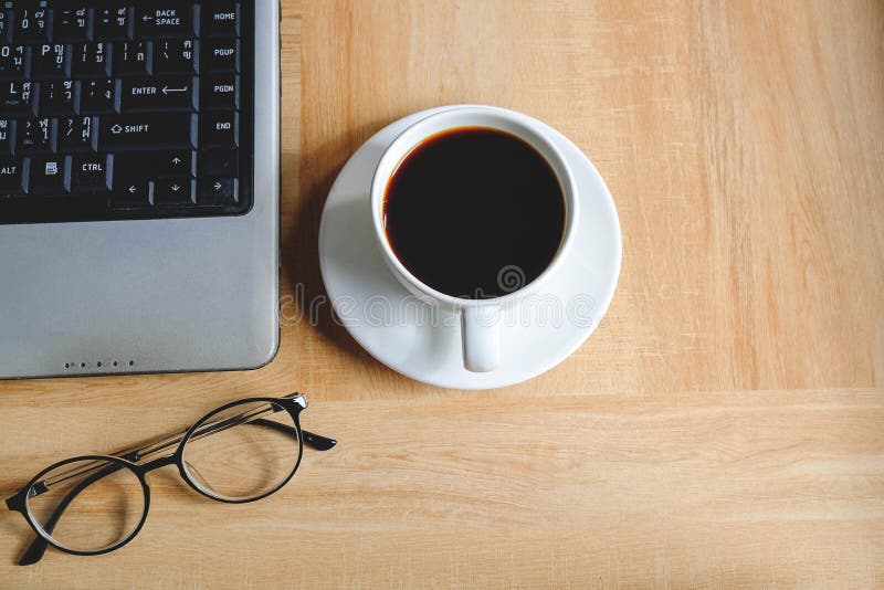 Coffee cup on work table stock photo. Image of computers - 126637788