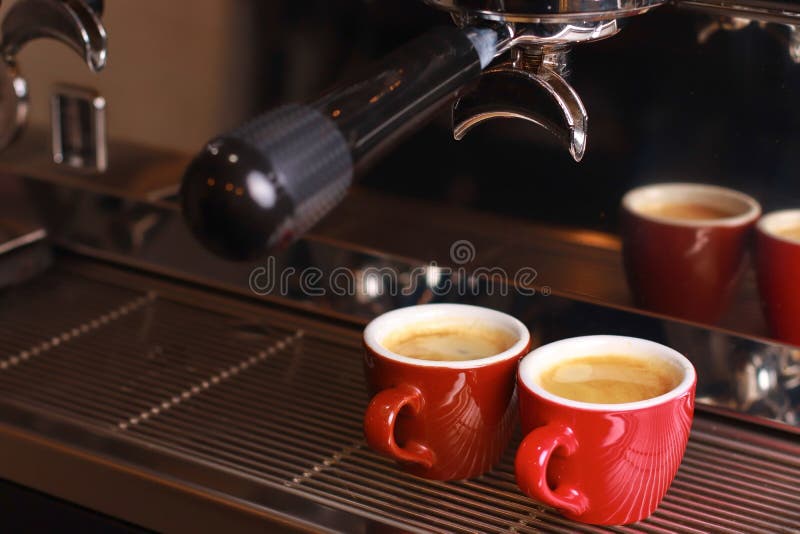 Coffee Cups Stand Inside the Coffee Machine on a Grid, Fresh Coffee is ...