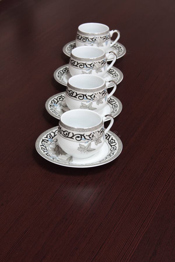 Coffee Cups Stand on a Table Stock Image - Image of brown, water: 12076963