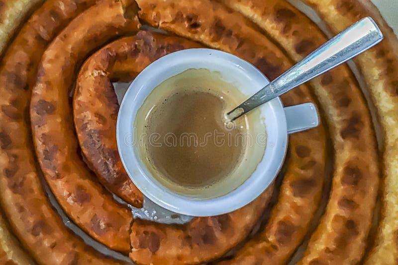 Coffee Cut with Milk, in the Center of a Portion of Churros. Stock ...